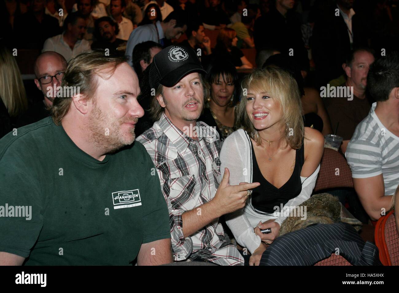 David Spade, center, with Kevin Farley, left, and a guest at UFC 76 ...