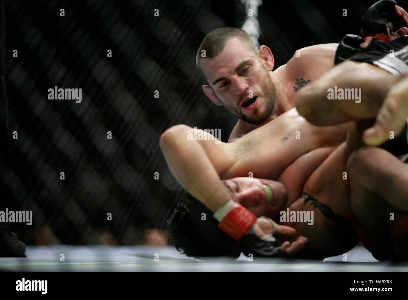 Jon Fitch, top, fights Diego Sanchez at UFC 76 during a mixed martial ...