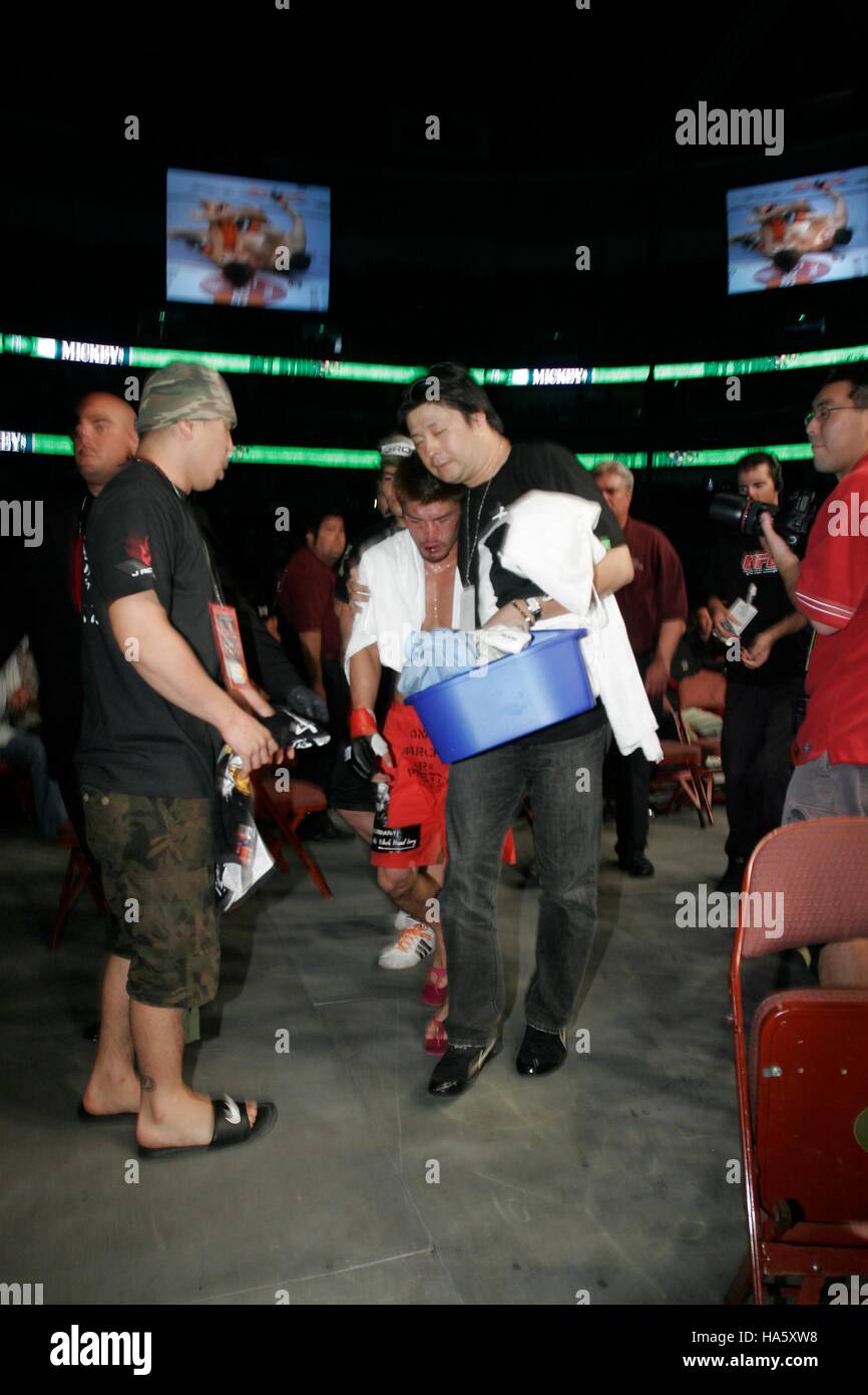 Michihiro Omigawa is helped out of the ring after losing to Matt Wiman ...