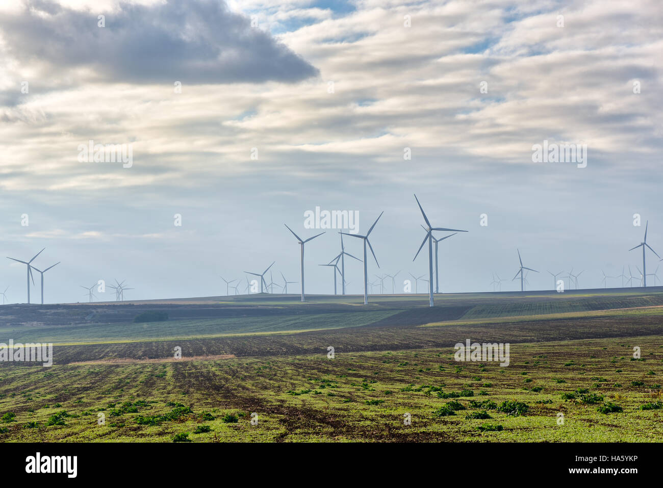 Eolian field and wind turbines farm on a cloudy day Stock Photo - Alamy