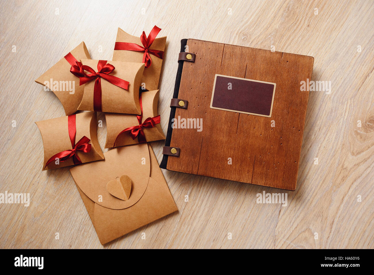 book and gift boxes on wooden background Stock Photo - Alamy