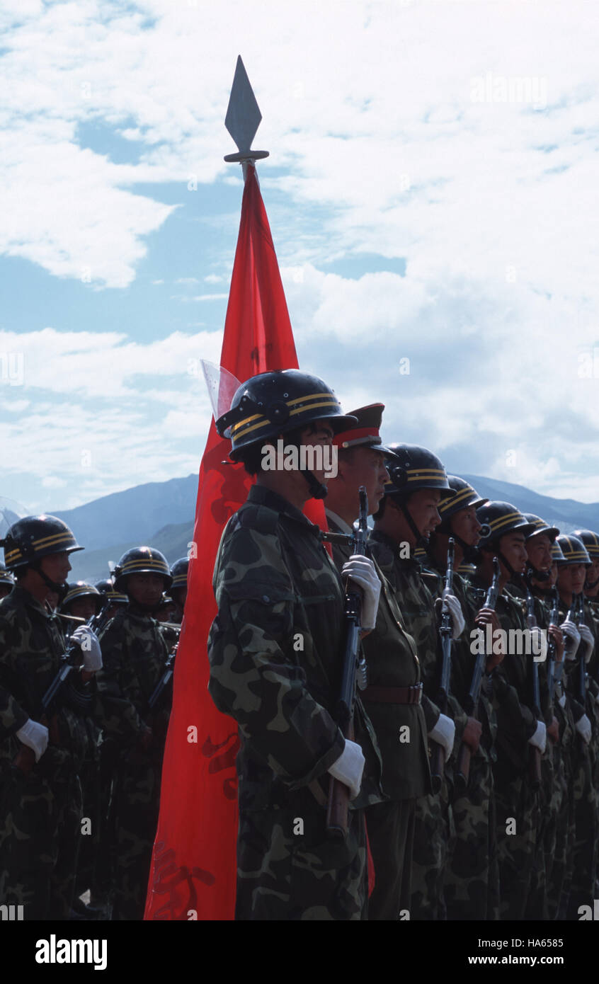 Caption: Yushu, Quinghai, China - Jul 2002. Army personel standing to ...