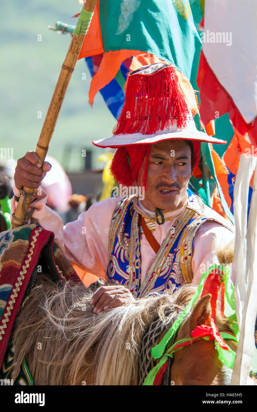 A Khampa horseman, dressed in ceremonial dress, at the Yushu Horse ...