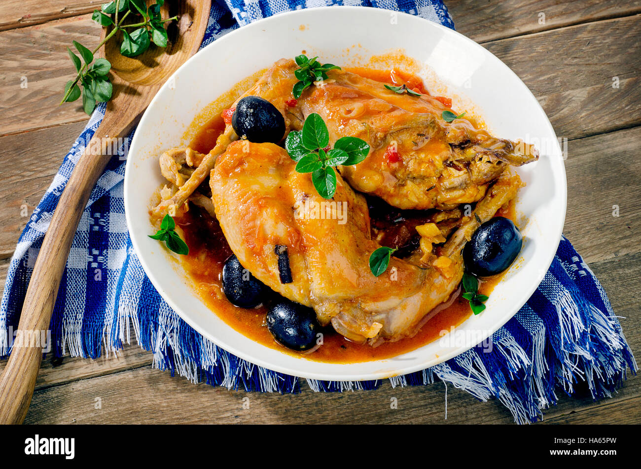 Stewed rabbit legs with olives and herbs. View from above Stock Photo ...