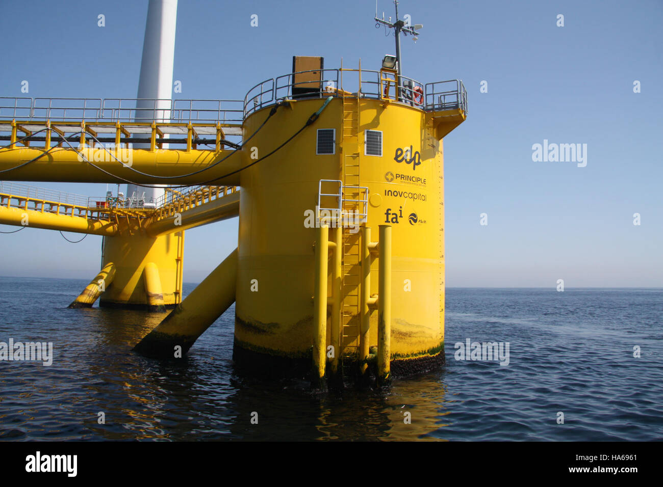 The image showcases a floating offshore wind turbine off the coast of ...