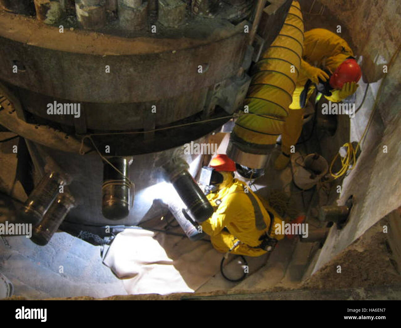 Workers are seen inside the High-Level Waste Canister Transfer Room ...
