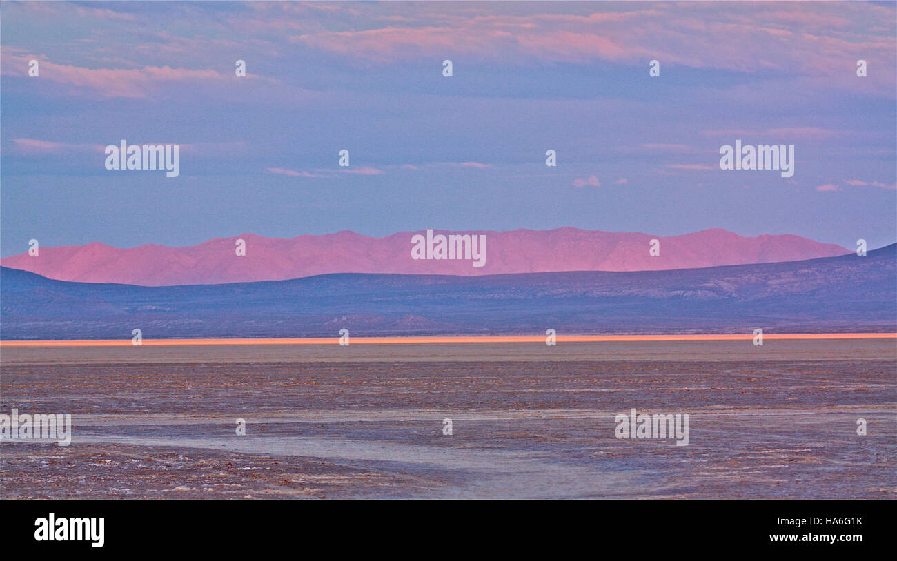 This image shows a stunning sunset over a national park in Nevada ...
