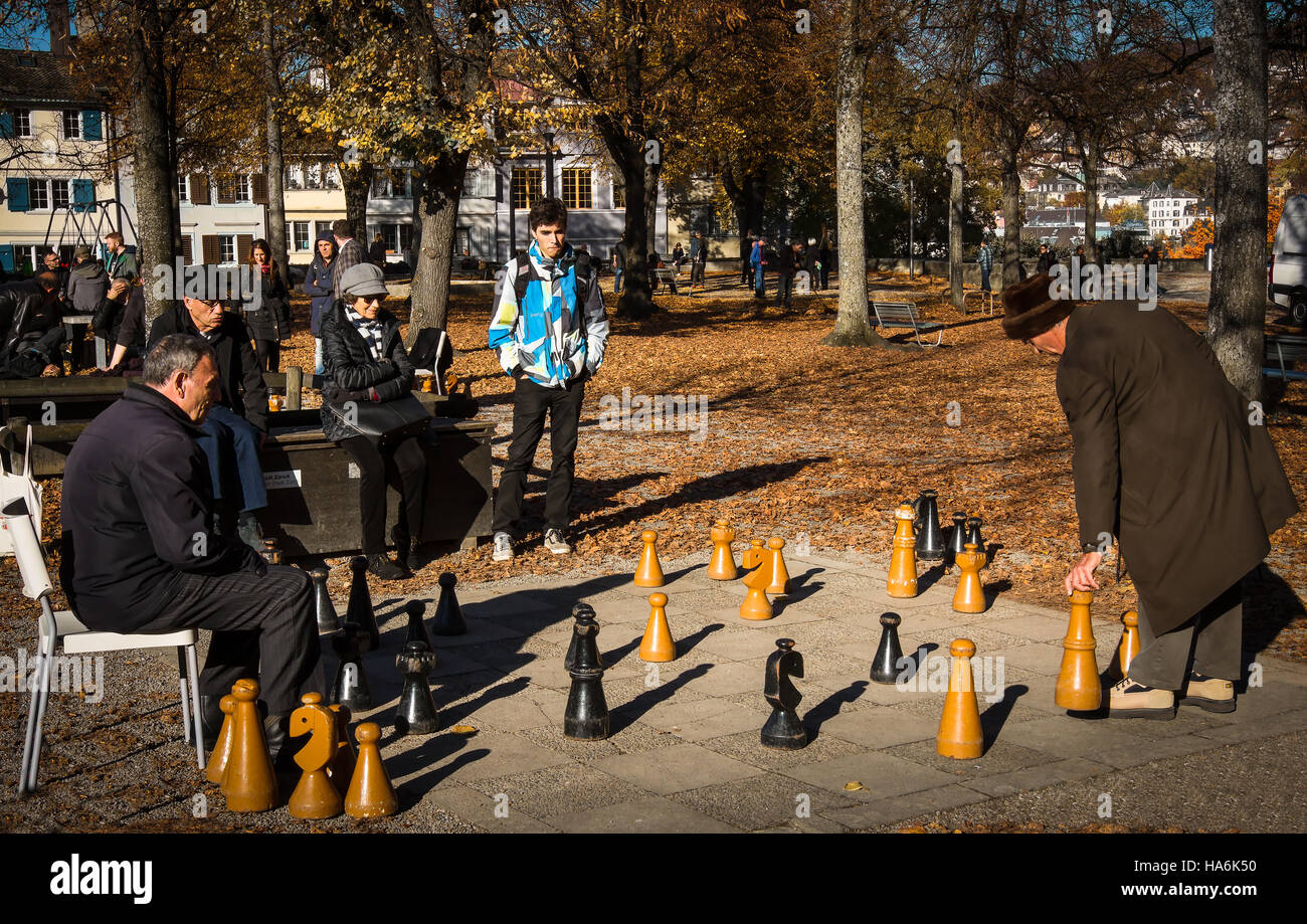 Playing giant chess in the park Stock Photo - Alamy
