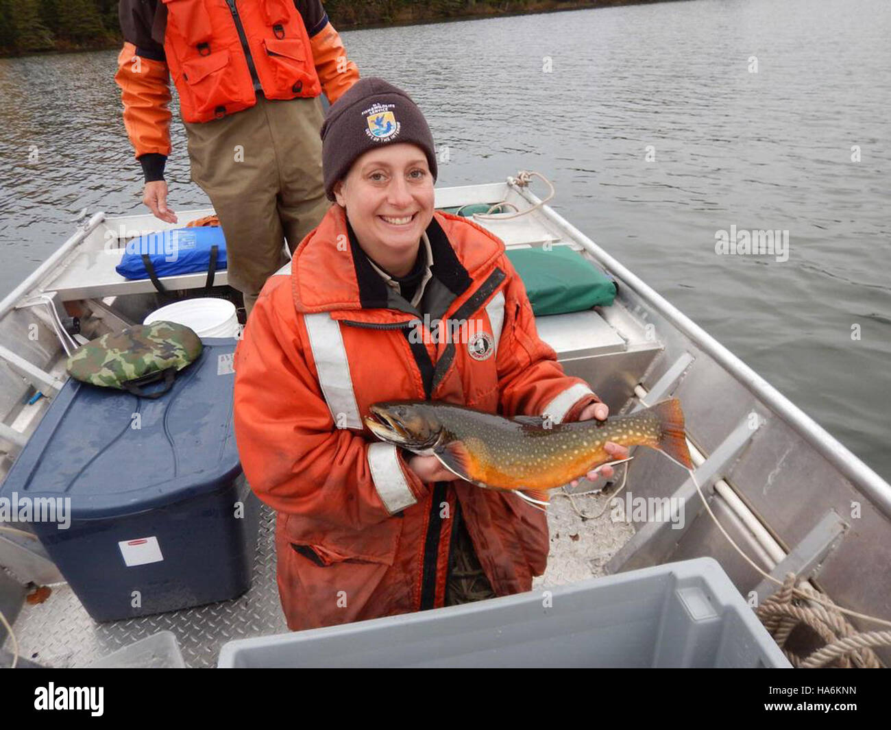 Carey Edwards, a biologist from Iron River National Fish Hatchery in ...
