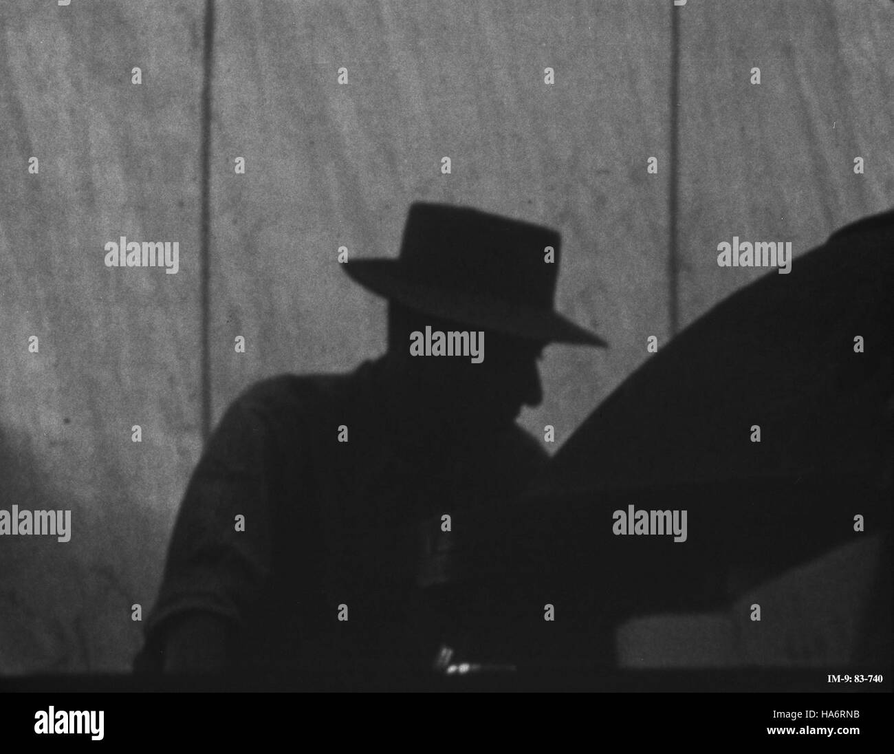 This image shows J. Robert Oppenheimer overseeing the final assembly of ...