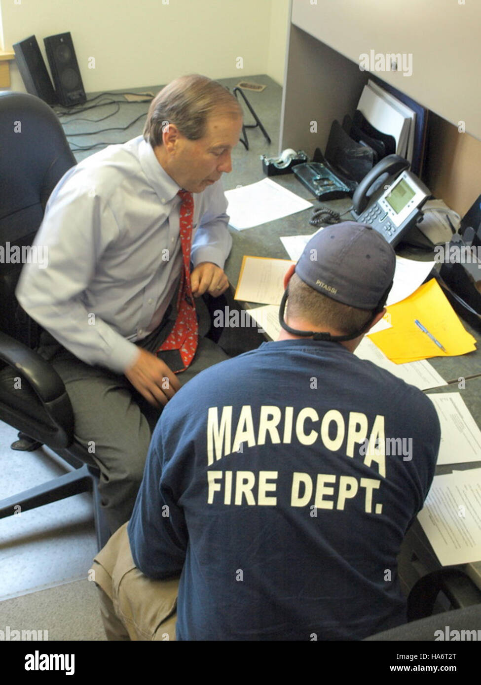 Photograph of Senator Tom Udall and an intra-agency official receiving ...