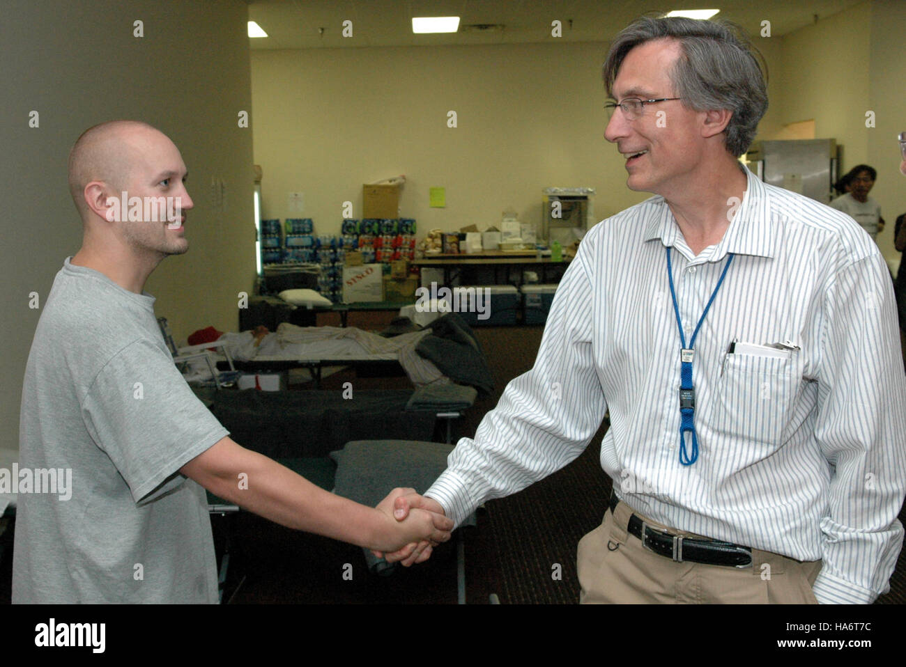 A lab director at Los Alamos National Laboratory greets an employee who ...