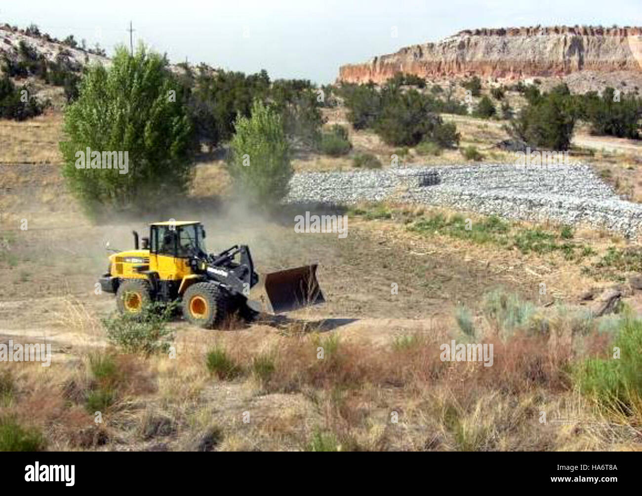 This image shows a frontloader at Los Alamos National Laboratory, with ...