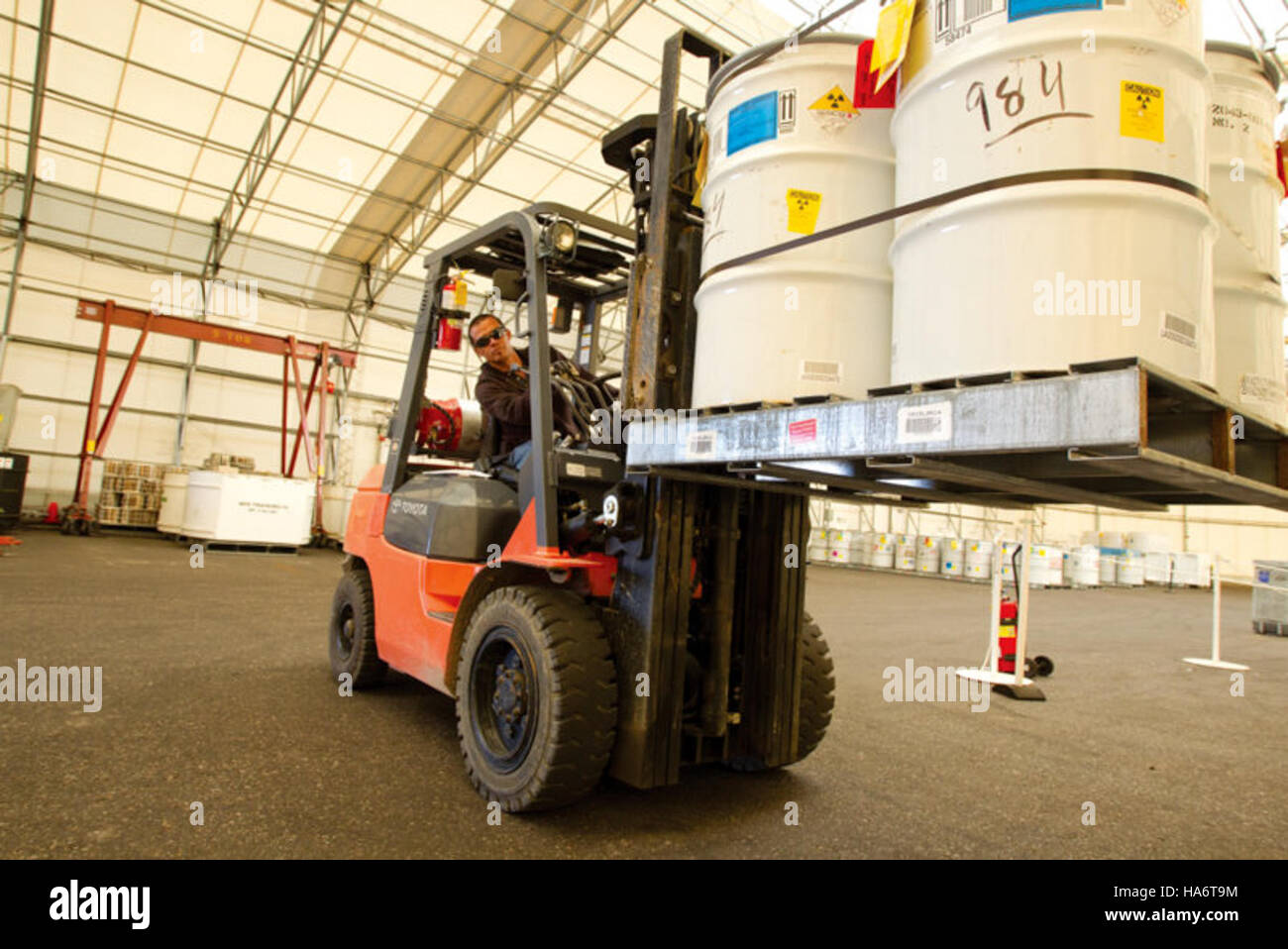 losalamosnatlab 6544503511 Worker moves drums of transuranic (TRU ...