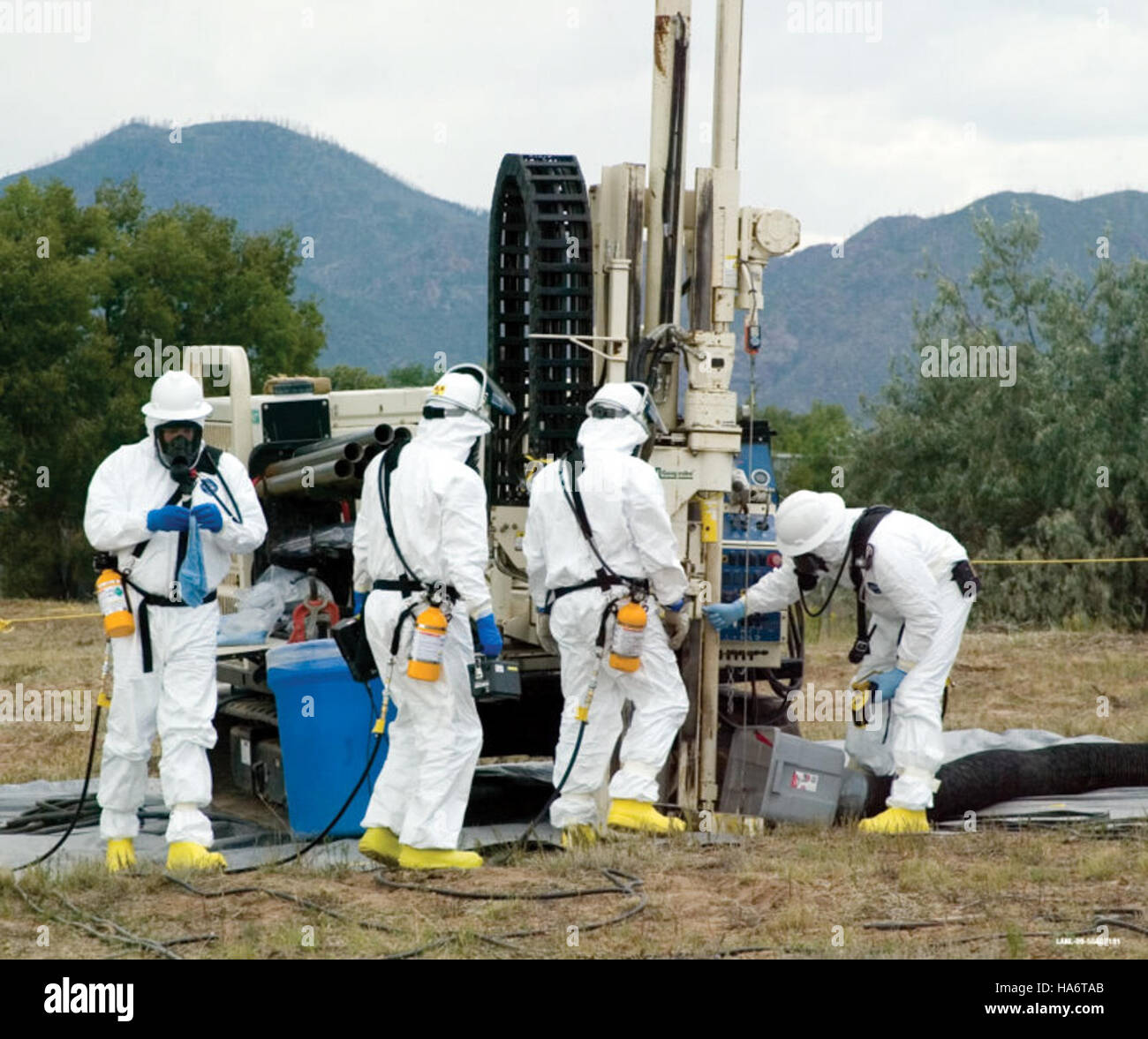 Workers sample materials in LANL’s Material Disposal Area B (MDA-B ...