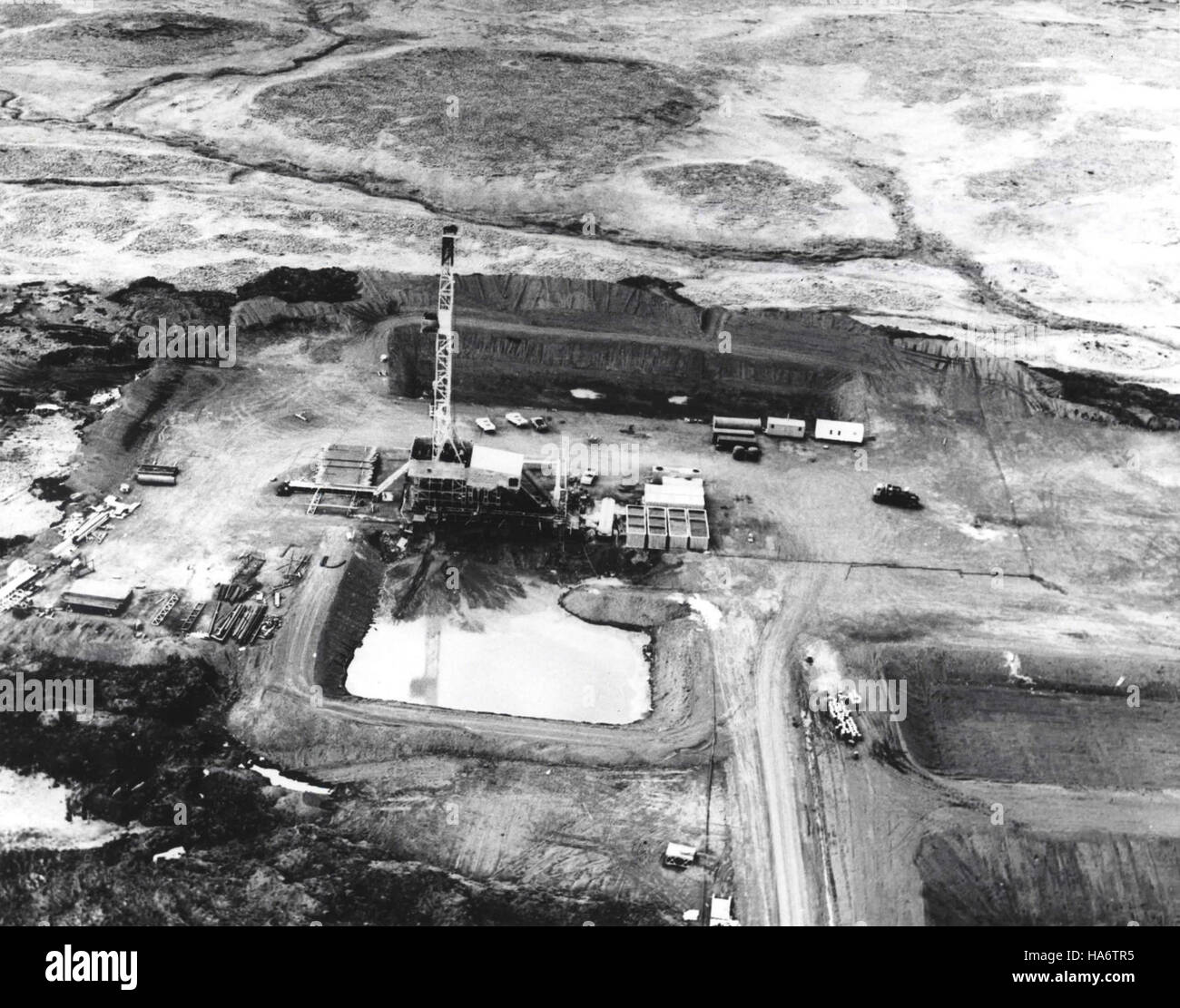 A drill rig is shown at the Amchitka Test Area, part of research ...