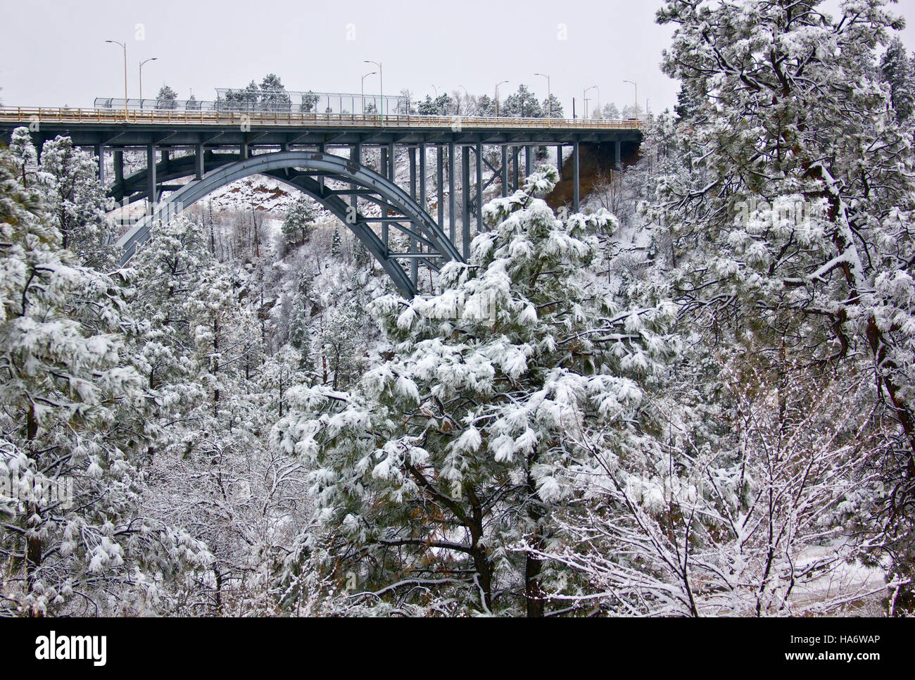 A winter scene at Omega Bridge in Los Alamos, showing the bridge ...