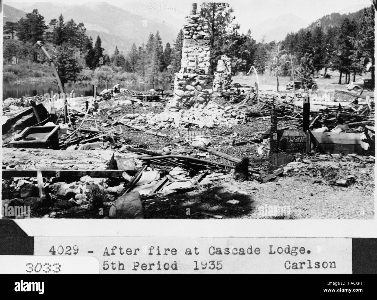 This historical image depicts the aftermath of a fire at Cascade Lodge ...