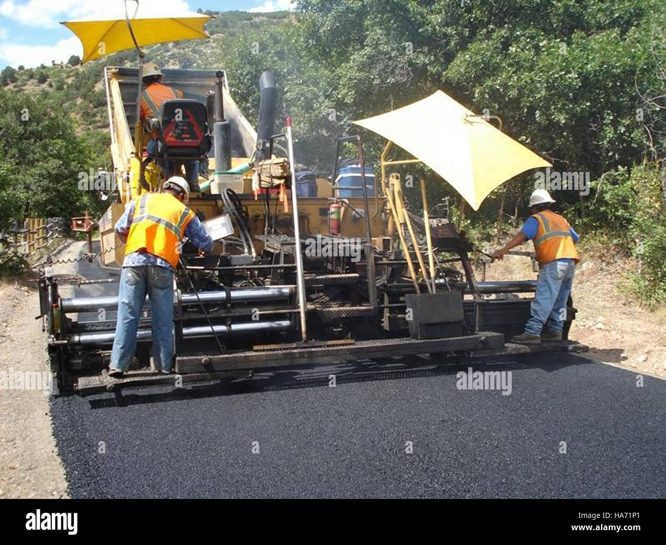 This photo depicts the laying of asphalt at a national park site, part ...