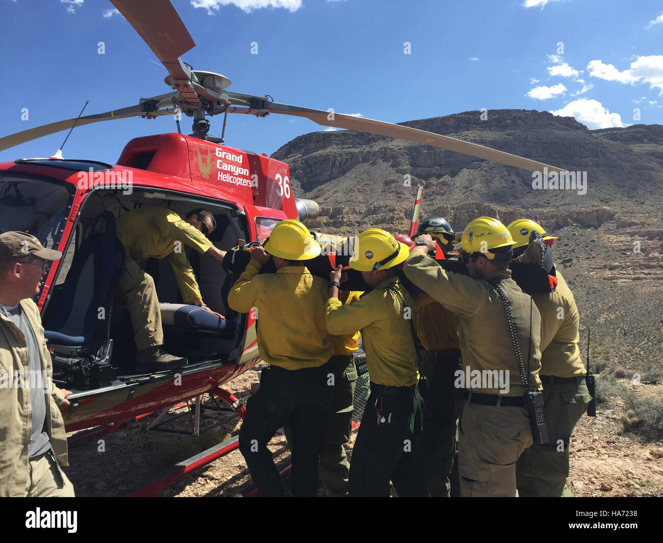 A Bureau of Land Management (BLM) helicopter transports a patient in a ...