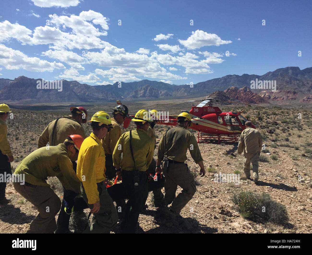 A Bureau of Land Management (BLM) helicopter approaches a site in ...