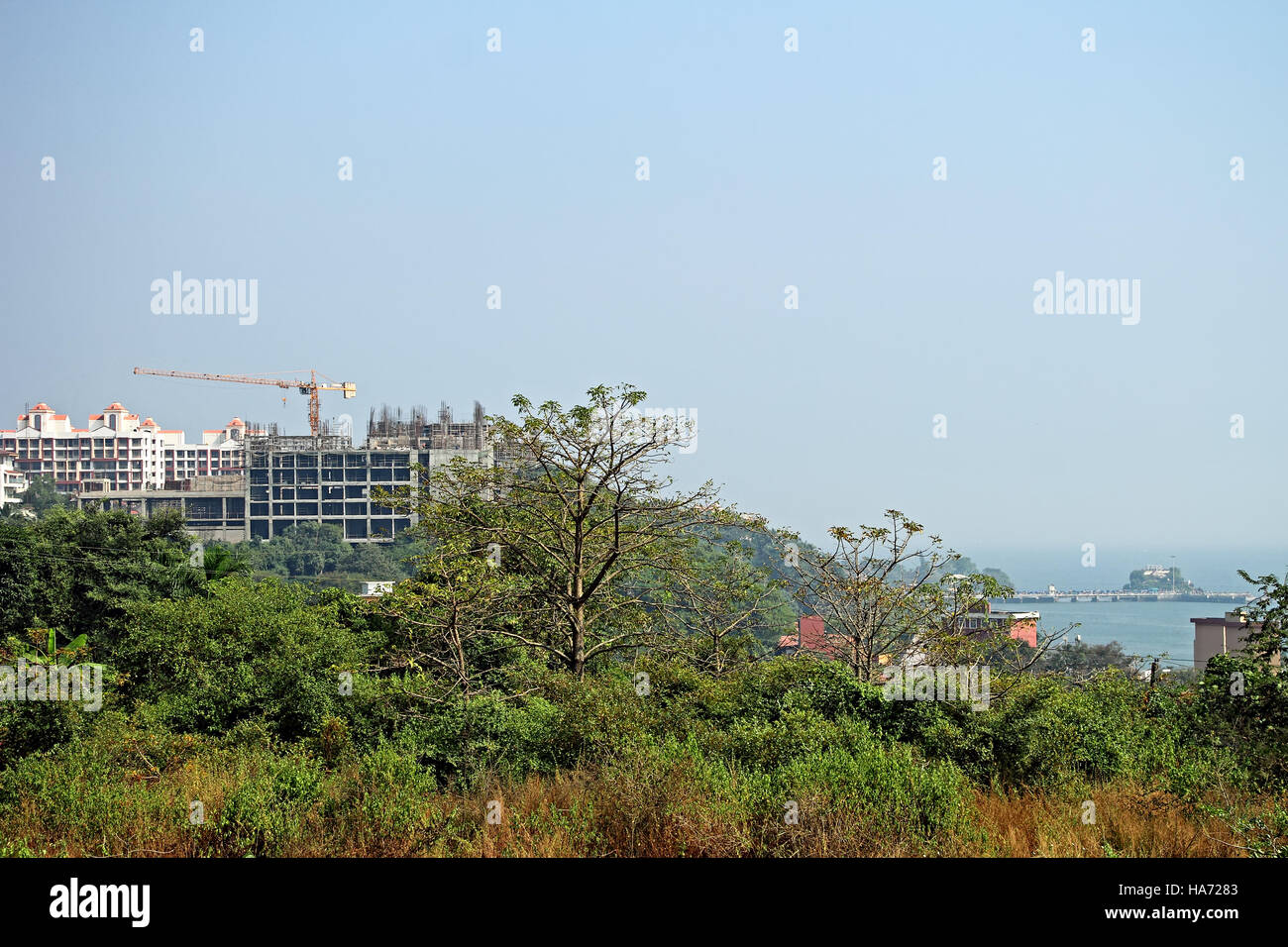 Construction of high-rise apartment buildings on a hillock with scenic ...
