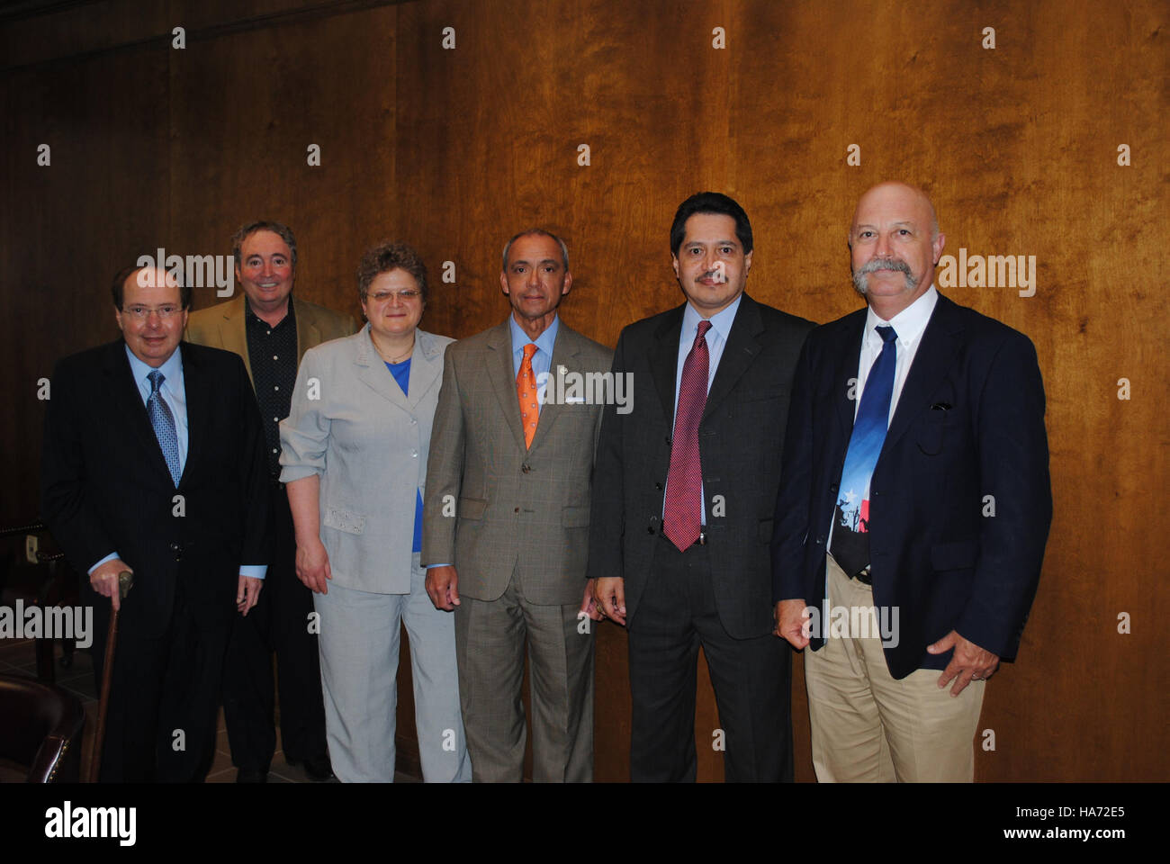 This image features a group gathered at Sam Kane, a location possibly ...