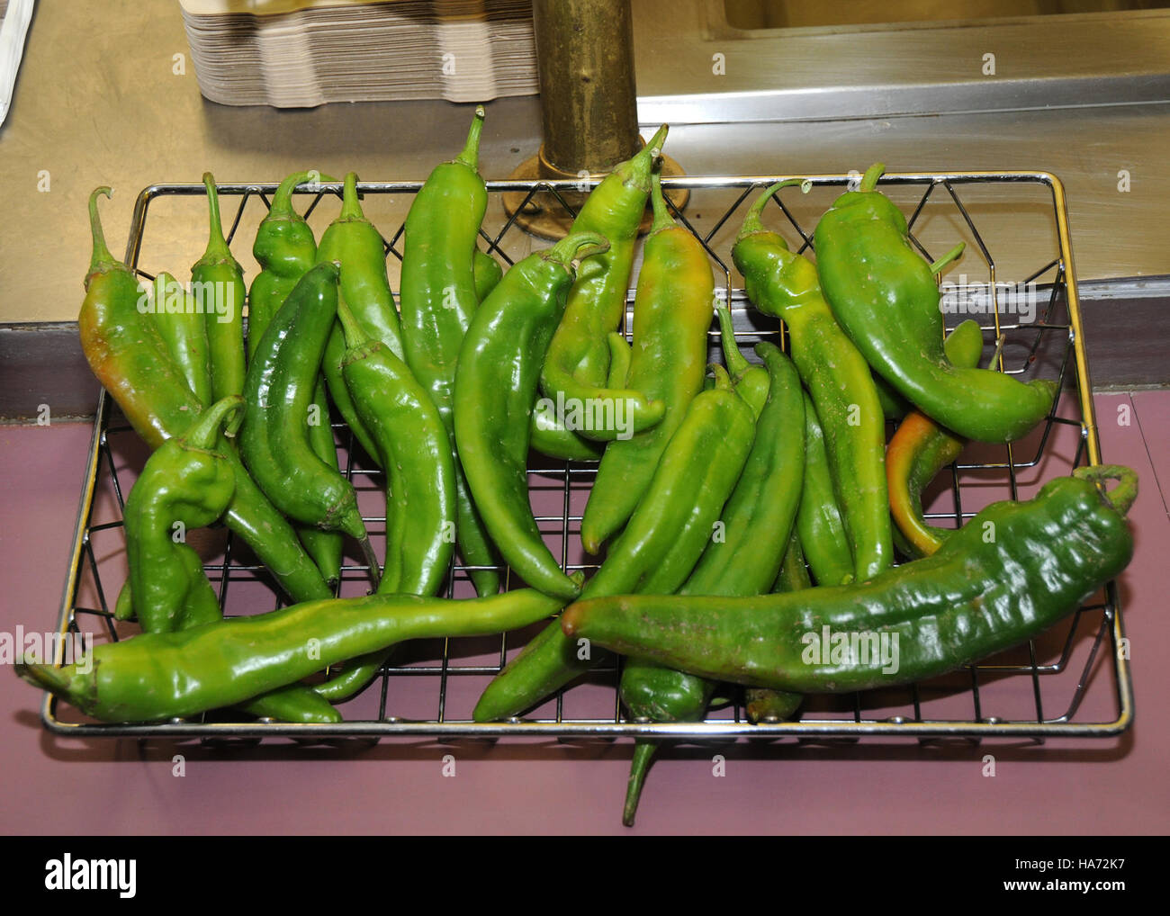 This image depicts Avalos green chiles, a variety of chili pepper often ...