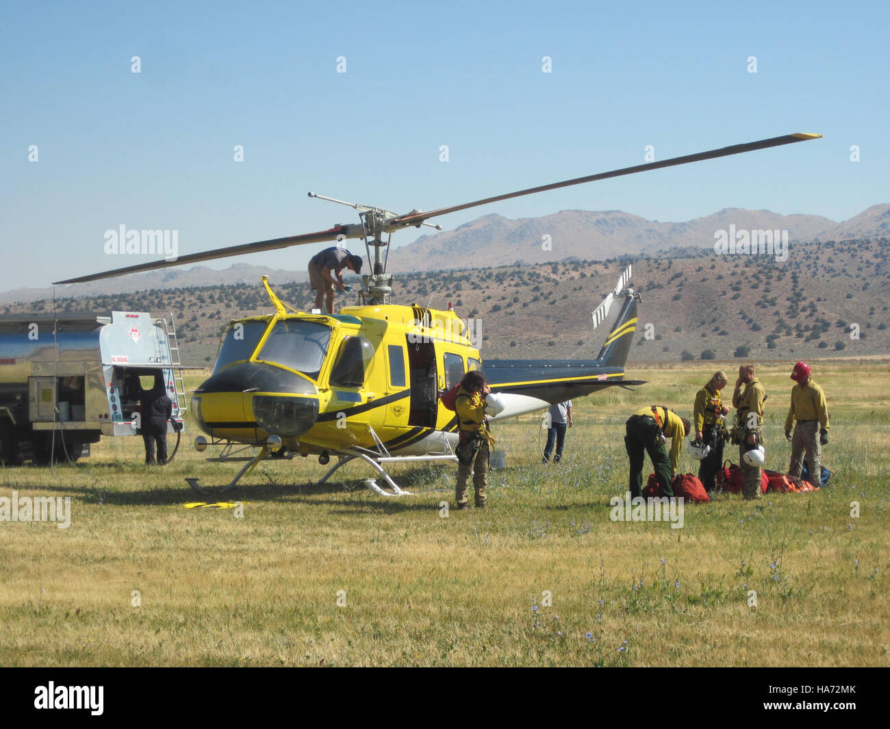 The image shows the Doyle Helibase Rapel Team in action, showcasing ...