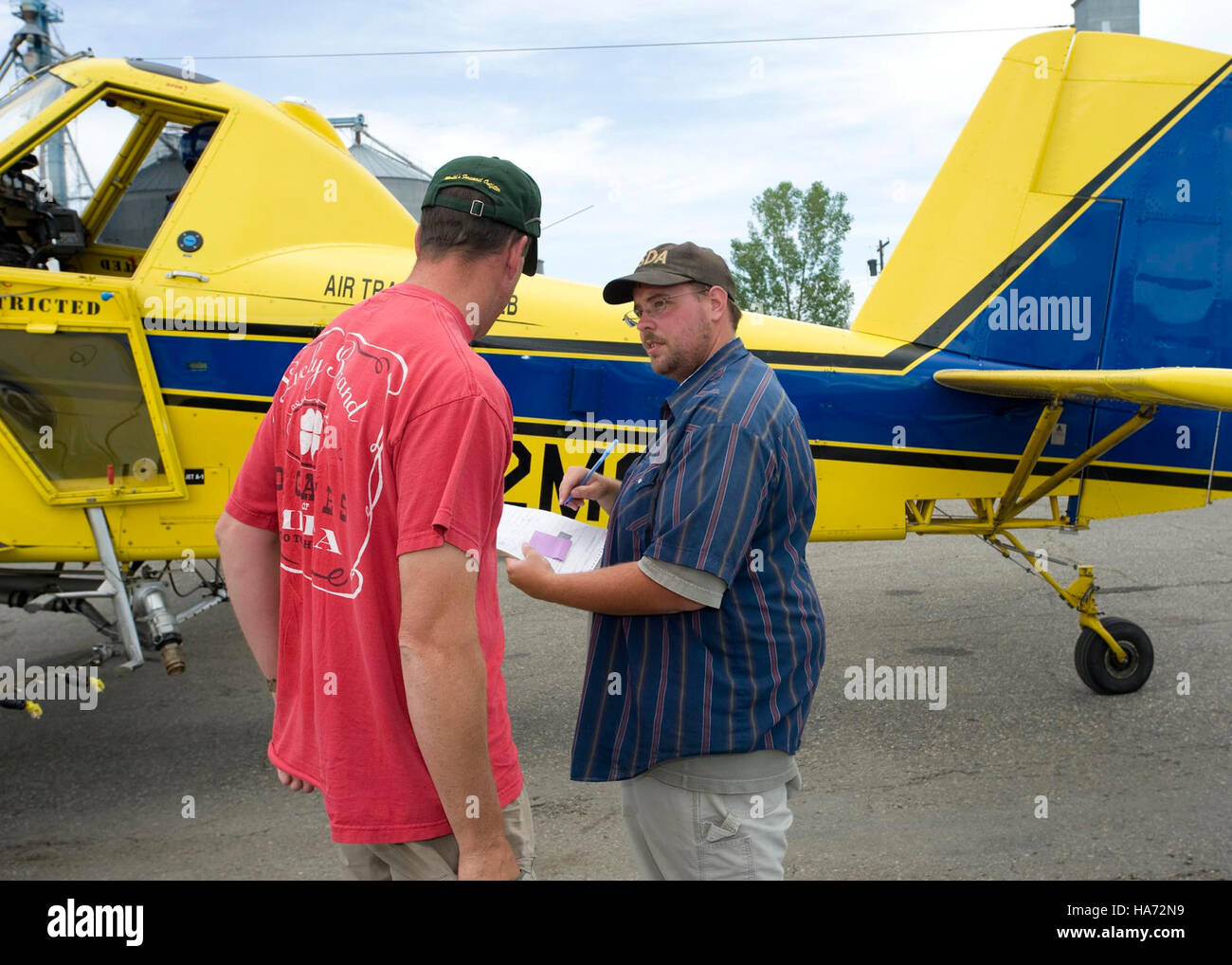 This image shows USDA employees planning aerial treatments to control ...