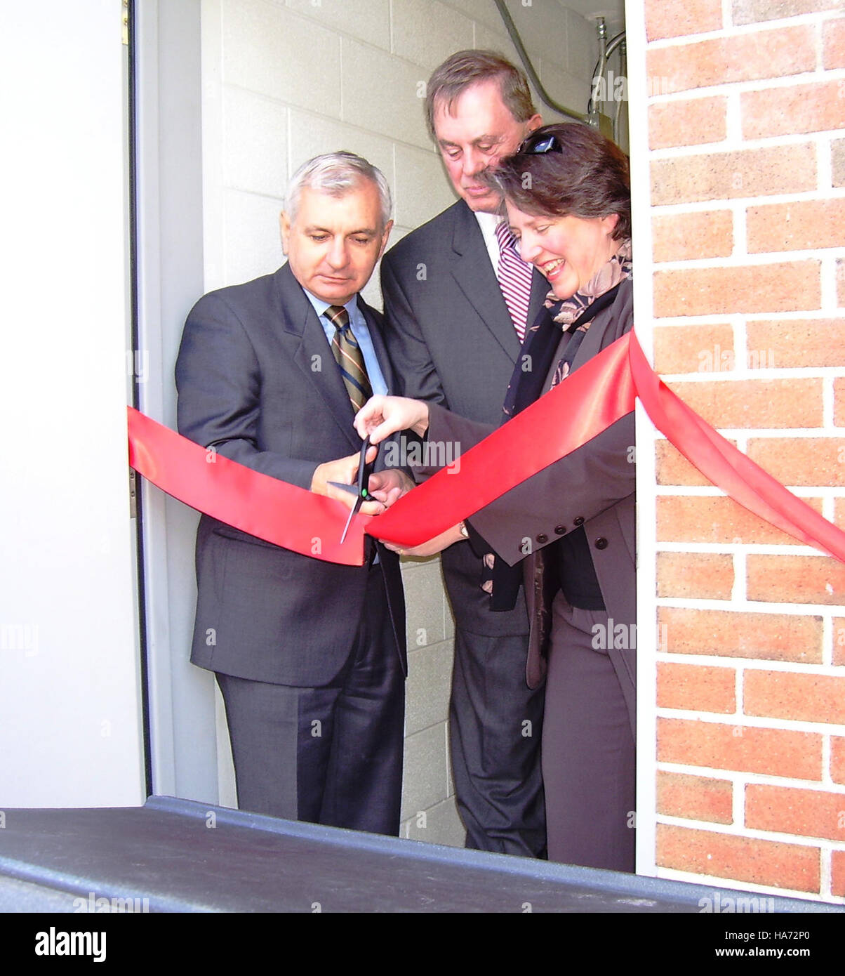 A photograph documenting a ribbon-cutting ceremony organized by the ...