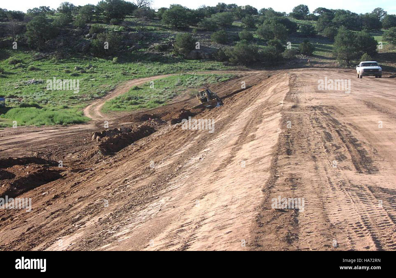 This image shows equipment used to push and compact fill material in a ...