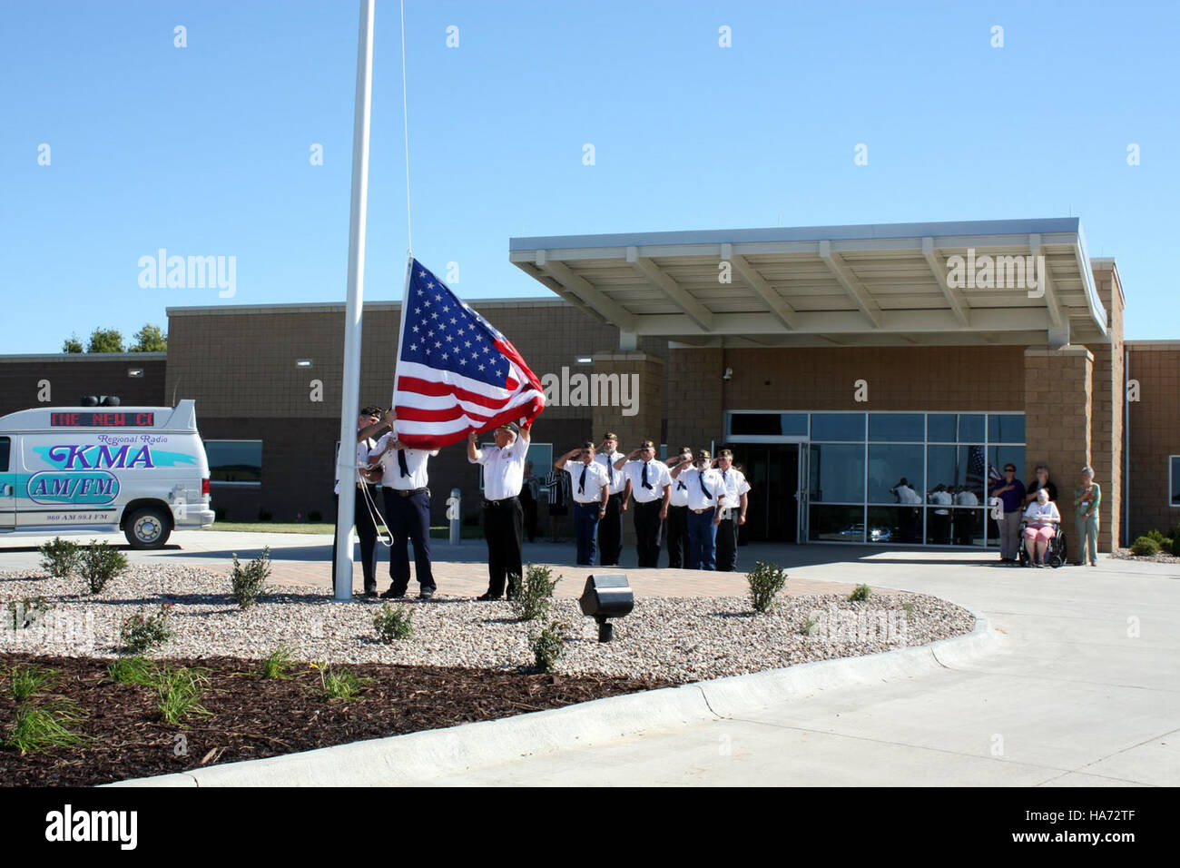 A photograph showing the raising of the U.S. flag at a new hospital in ...