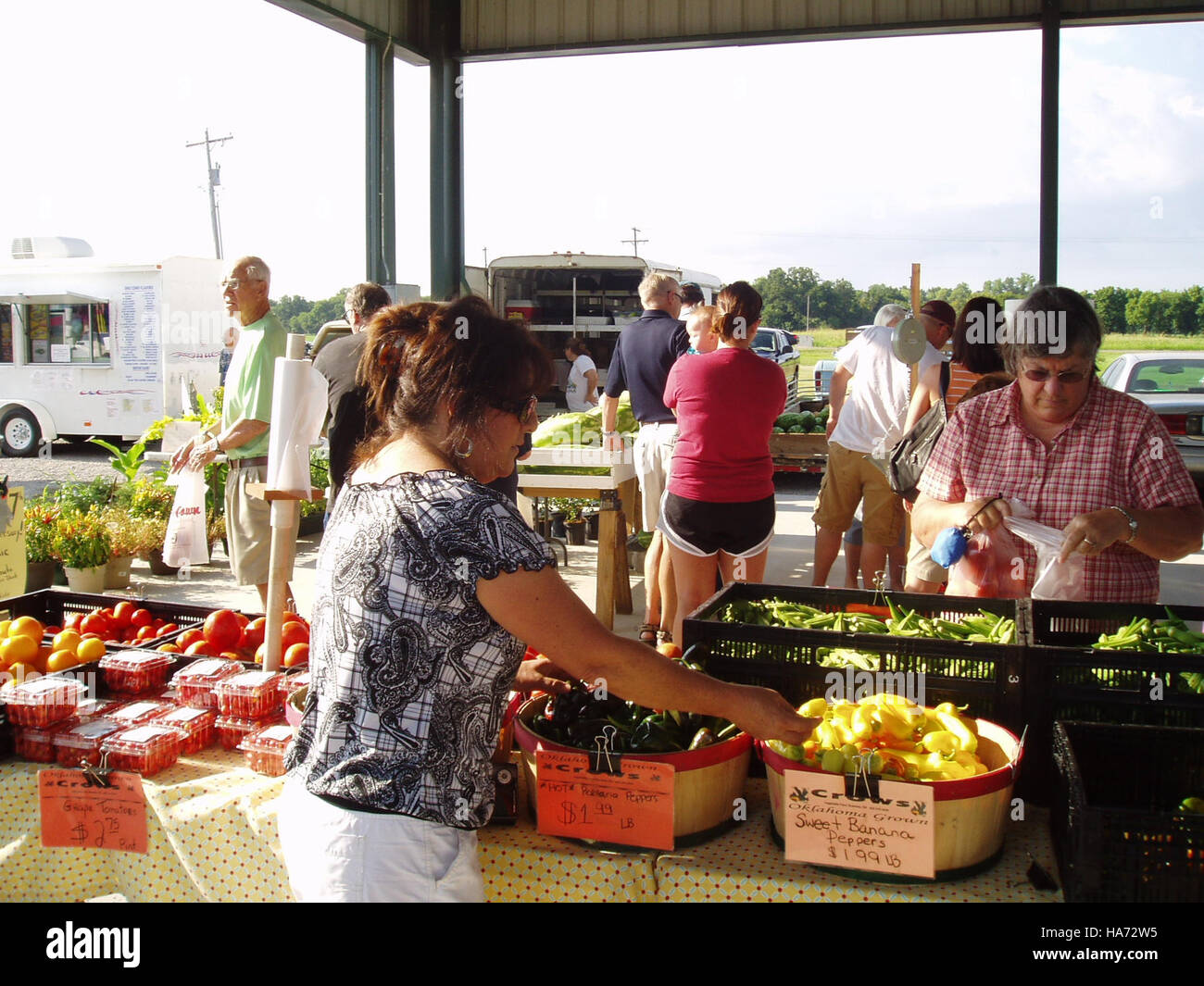 A photograph of a bustling farmers market, showcasing local produce and ...