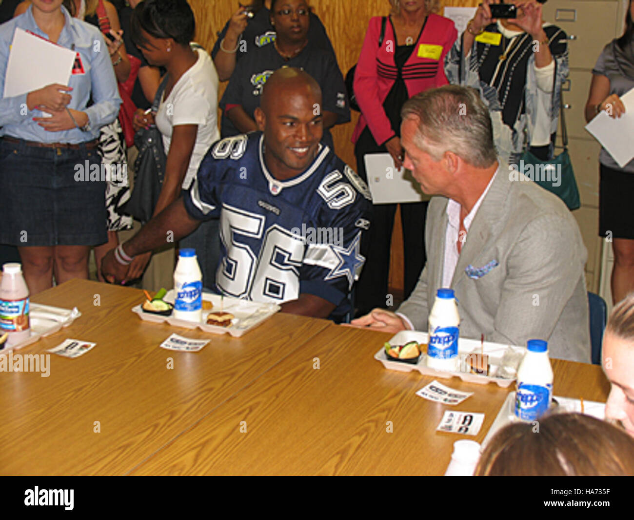 This image captures a moment at a cowboy-themed event, showcasing the ...