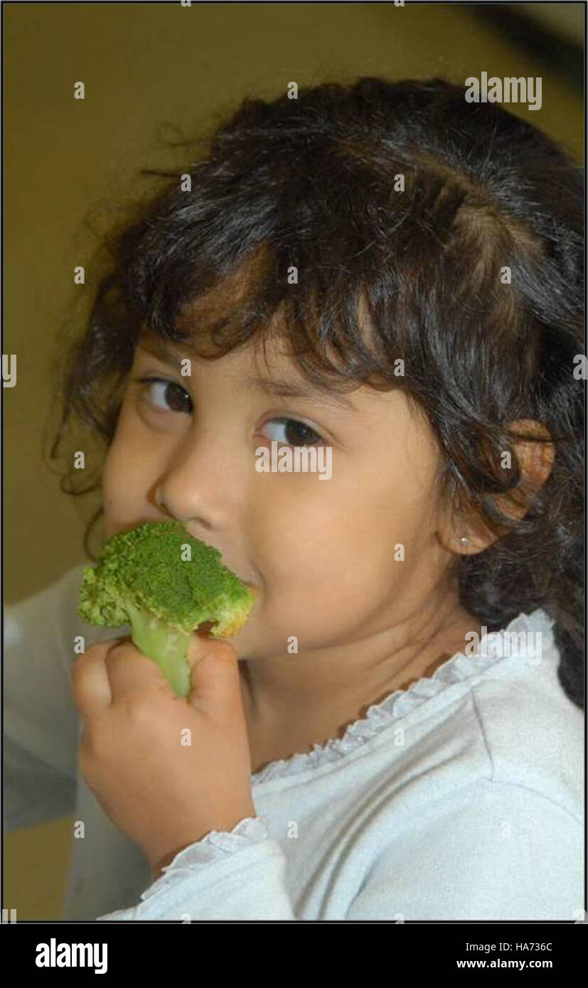 The 'Broccoli Girl' image depicts a young girl with a bunch of broccoli ...