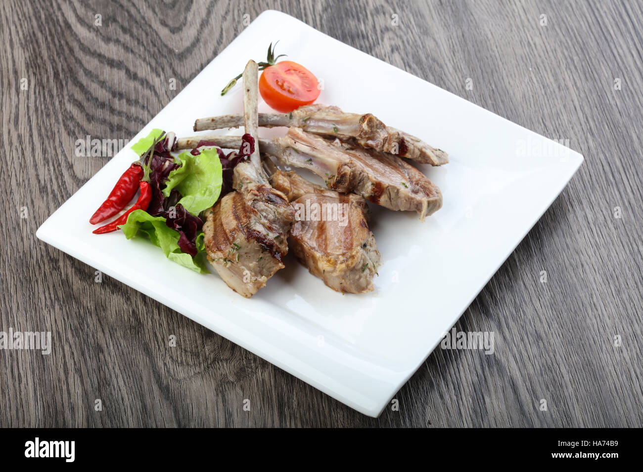 Lamb Frenched Rack grilled rib bone Stock Photo - Alamy