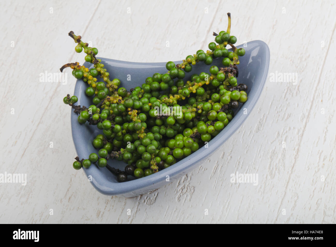 Green pepper corn on the branch in plate Stock Photo - Alamy