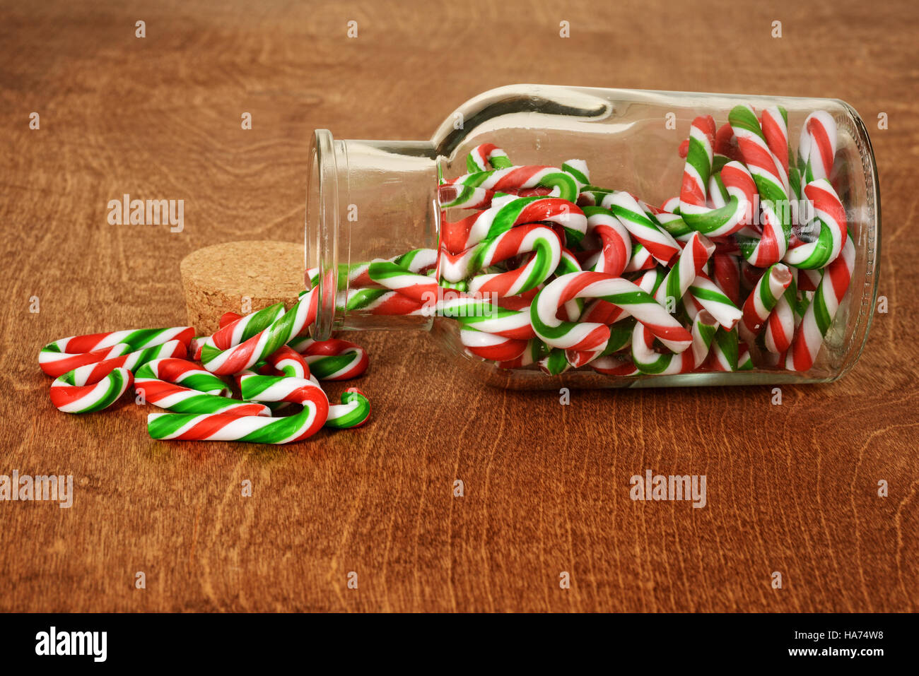 spilled jar of candy canes Stock Photo - Alamy