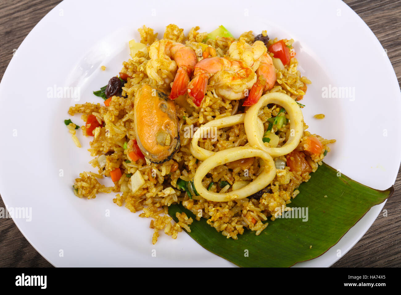 Fried rice with seafood - shrimp, mussel, squid Stock Photo - Alamy