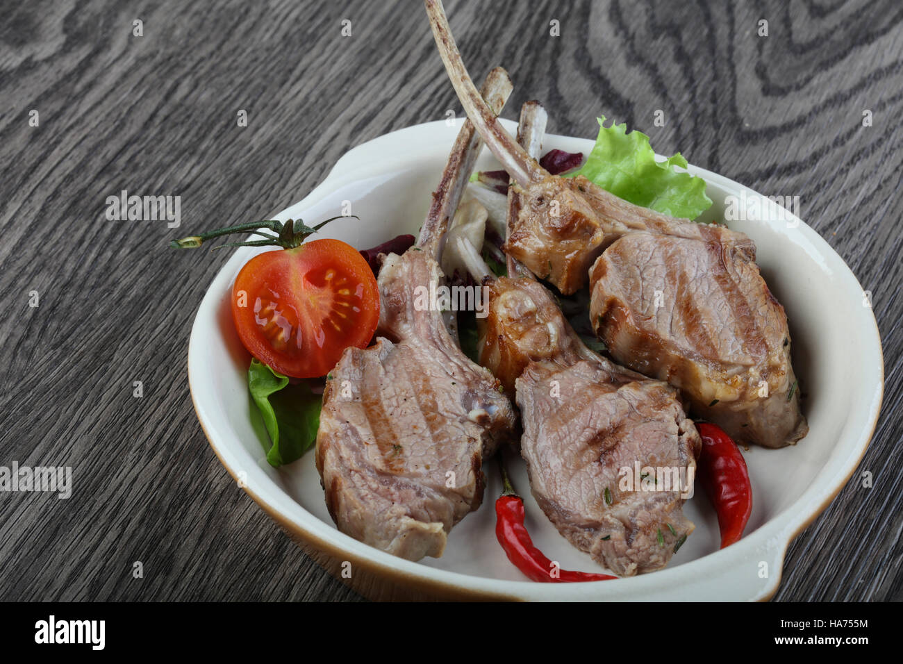 Lamb Frenched Rack grilled rib bone Stock Photo - Alamy
