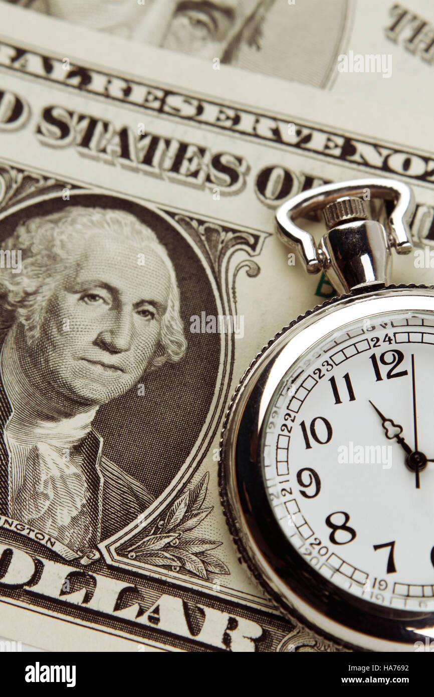 Watch and cash. Time is money Stock Photo - Alamy