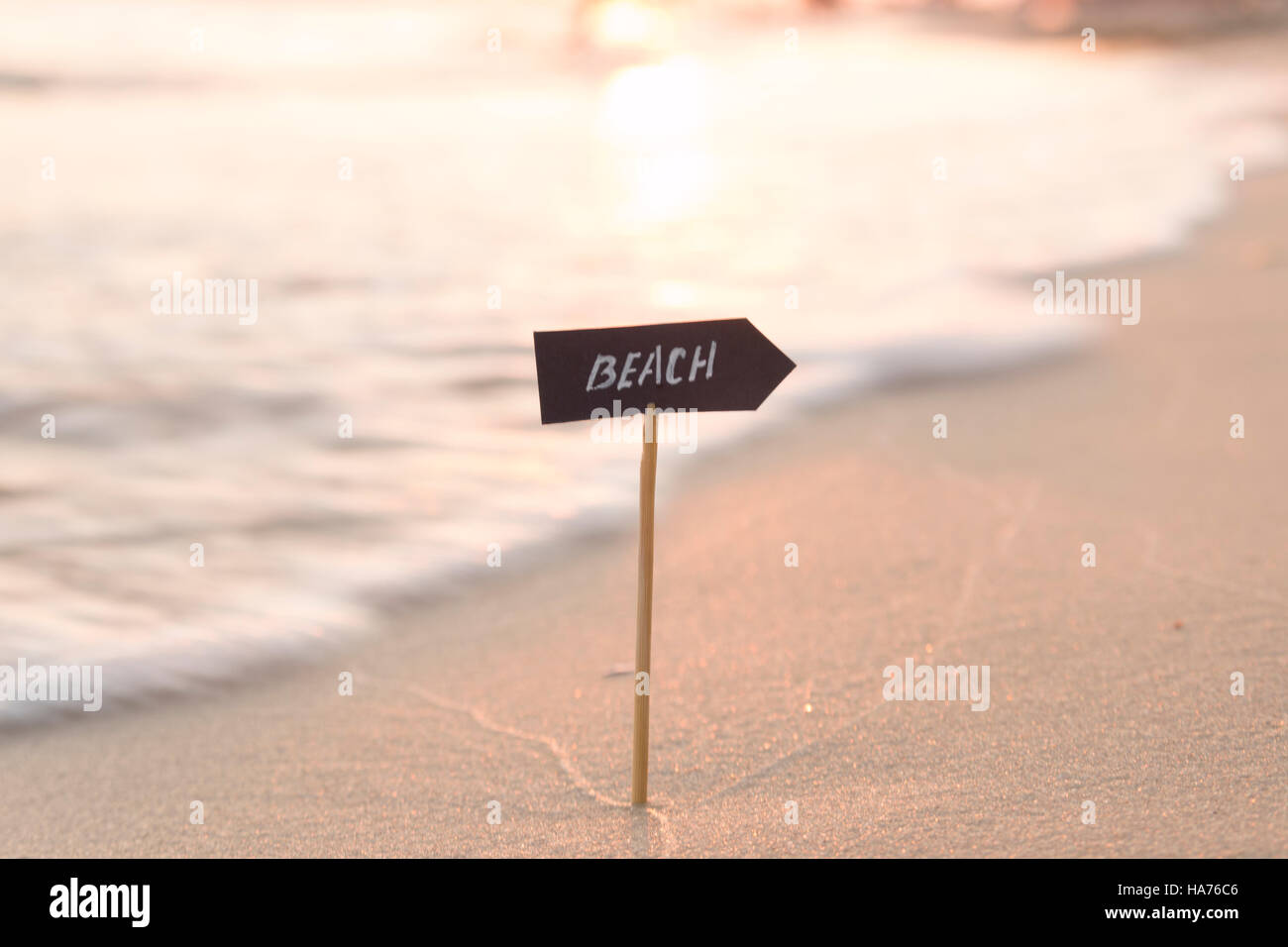 beach sing and beautiful sunset, sea on background Stock Photo - Alamy