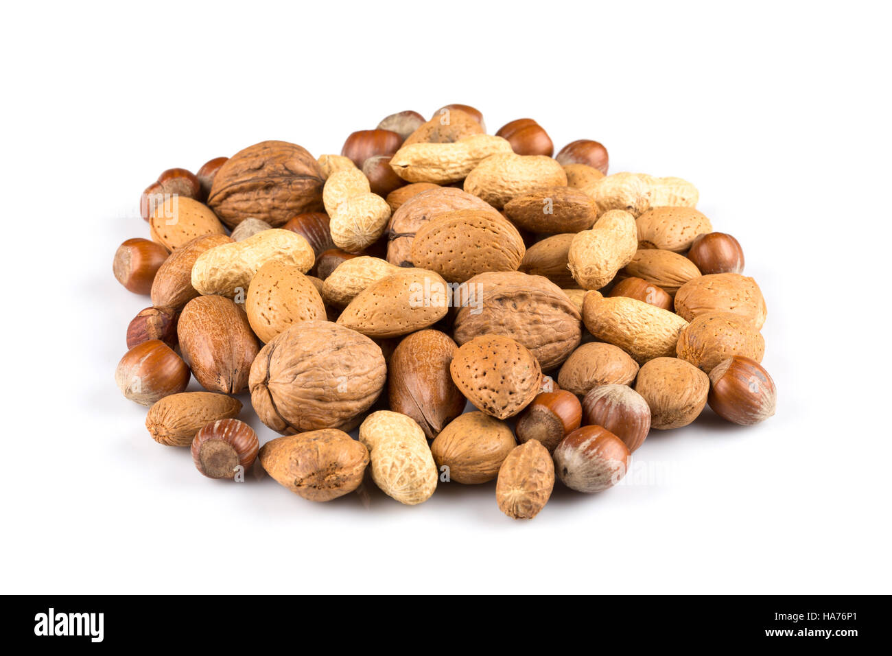 Mixed nuts in shells on a white background Stock Photo - Alamy