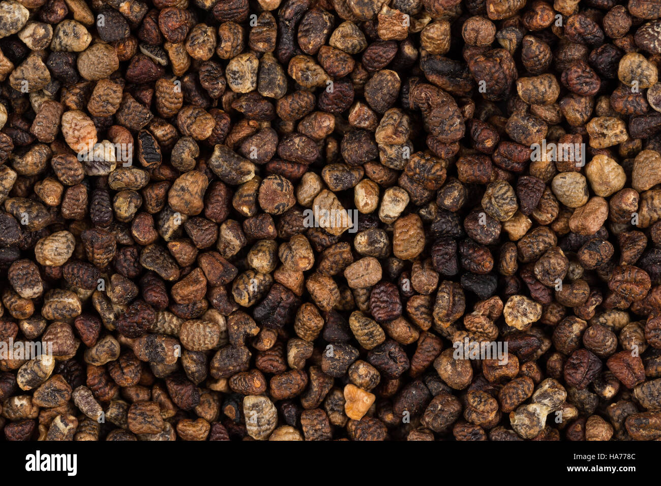 Decorticated cardamom seeds close up image can be used for background ...