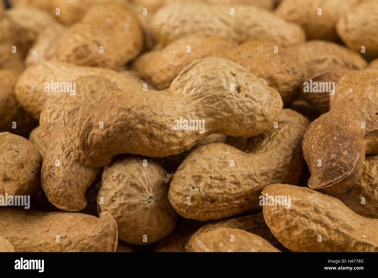 Pile of peanuts shells close up for background Stock Photo - Alamy