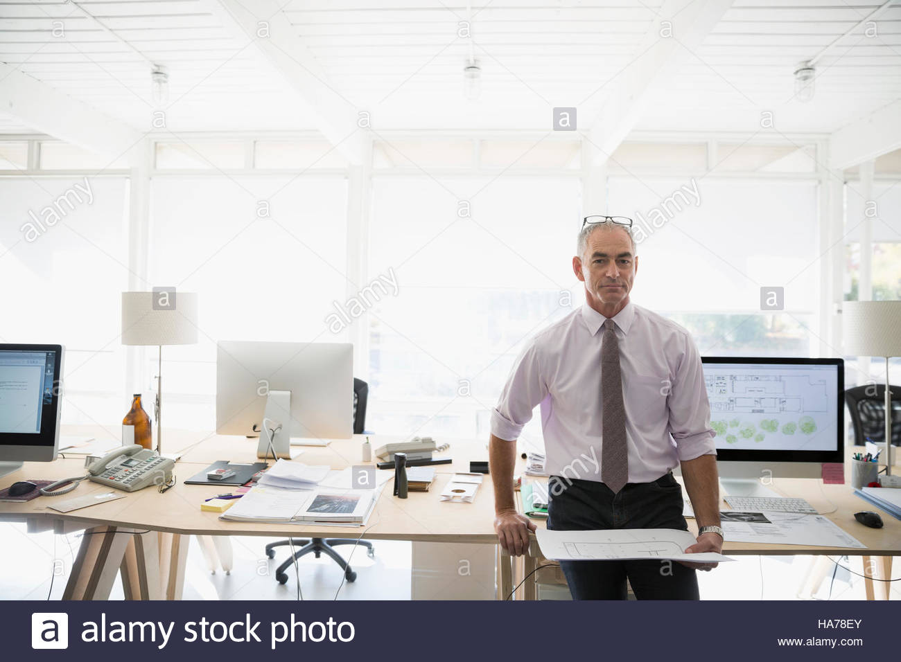 Man holding blueprint hi-res stock photography and images - Alamy