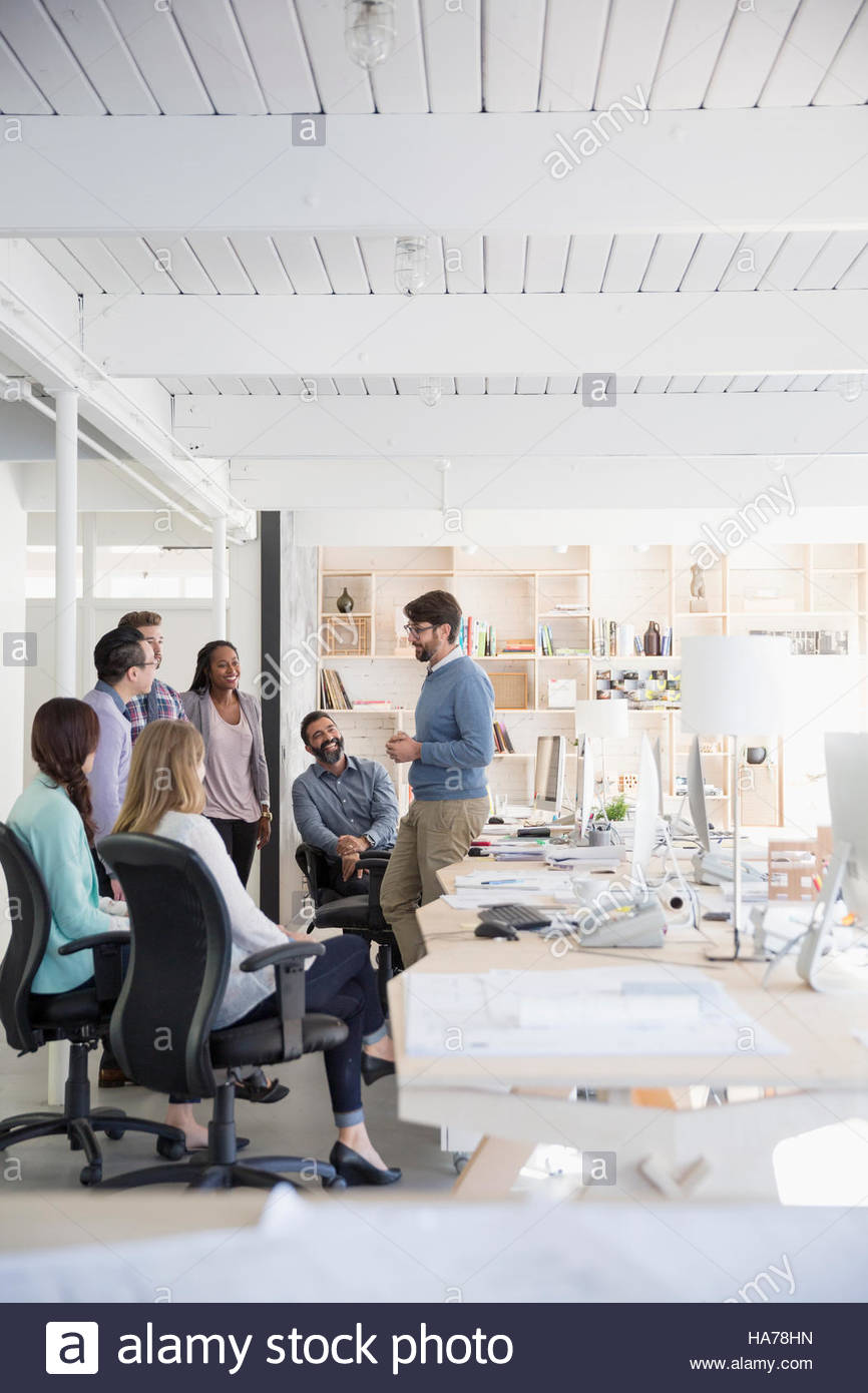 Architects meeting in open plan office Stock Photo - Alamy
