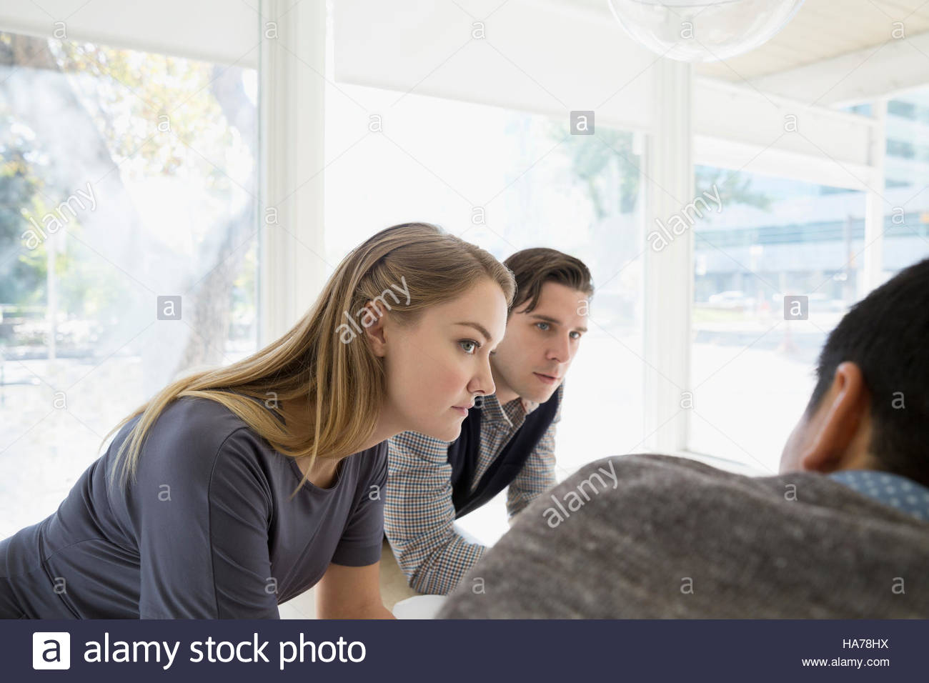 Attentive business people listening in meeting Stock Photo - Alamy