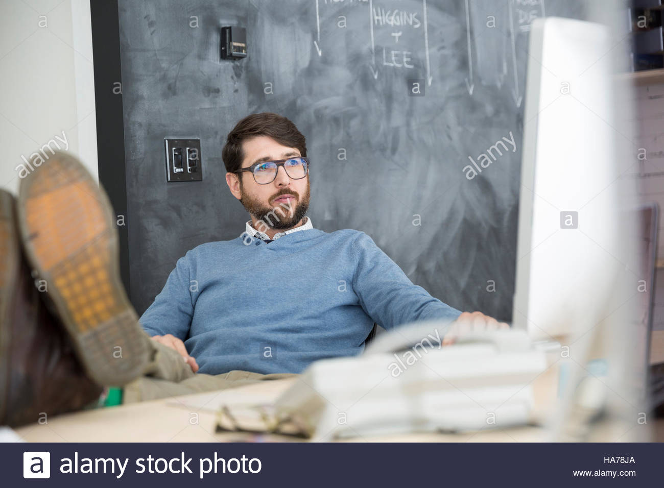 Business man feet on desk hi-res stock photography and images - Alamy